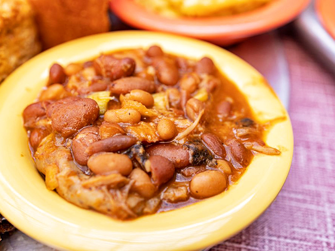 These aren't your sad, straight-from-the-can baked beans&mdash;they're a savory stew where beans mingle with smoky meat bits like they're at the world's tastiest pool party.