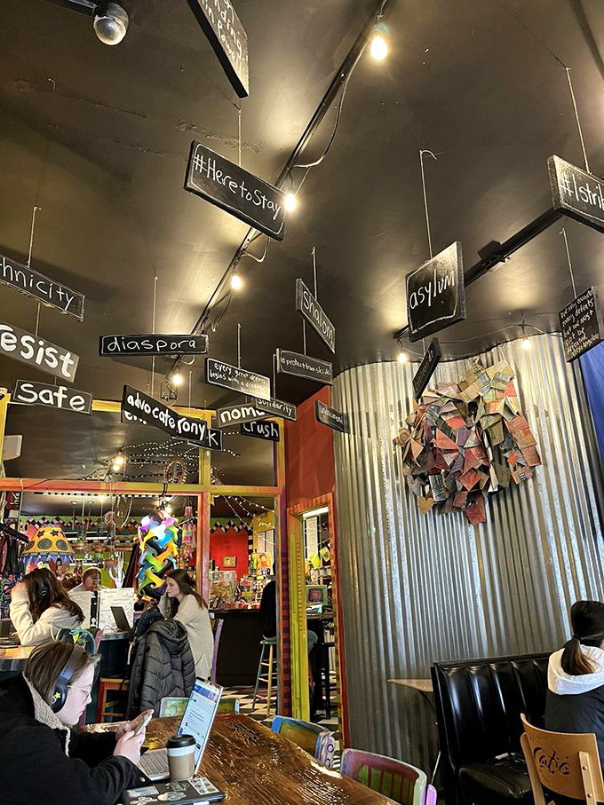 Words like "resist," "diaspora," and "authenticity" hang from the ceiling, making this possibly the only café where your coffee comes with vocabulary expansion.