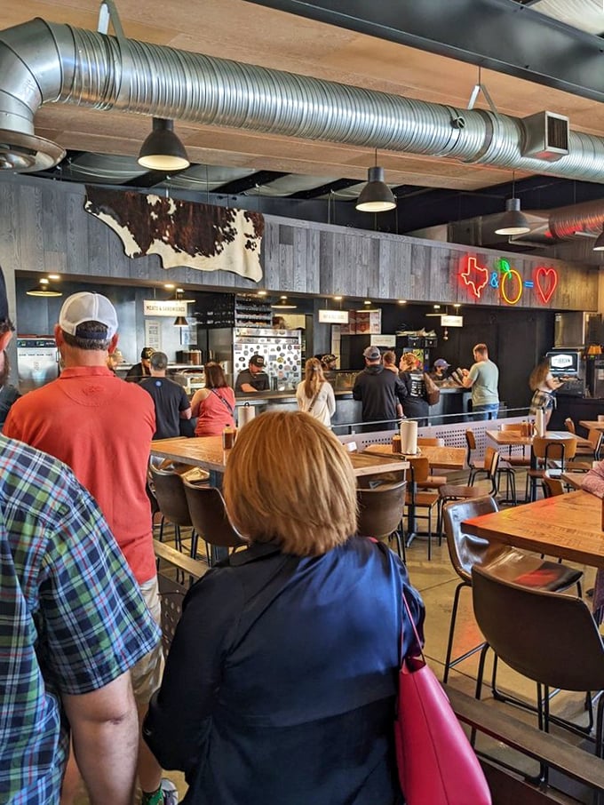 The line forms for a reason. These folks aren't just waiting&mdash;they're participating in a ritual that ends with smoky satisfaction.
