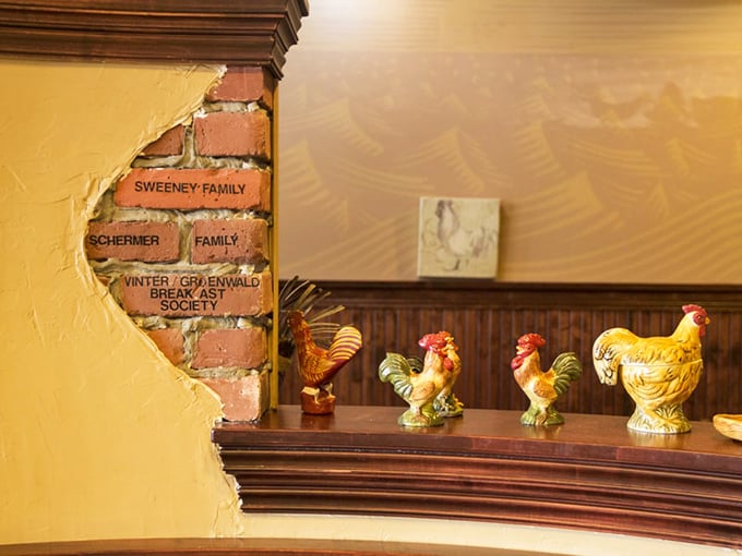 Those chicken figurines aren't just decoration&mdash;they're guardians of breakfast tradition. Note the family names etched in brick&mdash;regulars become family here.