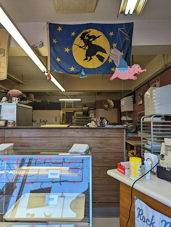 Local pride hangs from every wall. That Shawnee Mission jacket has witnessed more donut transactions than most of us have had hot breakfasts.