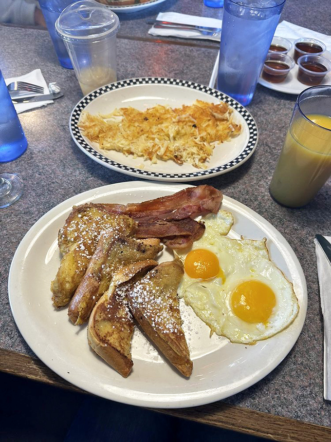 The breakfast plate that answers the question: "What if I want everything?" Crispy hash browns, sunny eggs, and French toast dusted with powdered dreams.