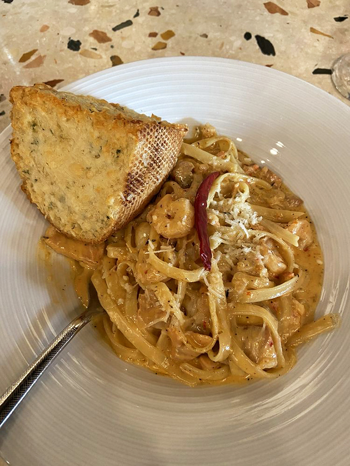 This seafood pasta isn't just a dish&mdash;it's a love letter to the ocean, with each twirl of linguine delivering shrimp and creamy coastal bliss.