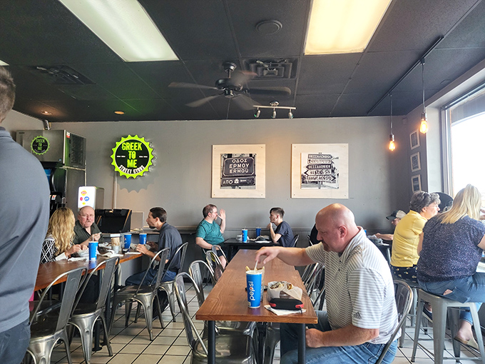 The universal language of good food brings strangers together at wooden tables, united by the common goal of gyro happiness.