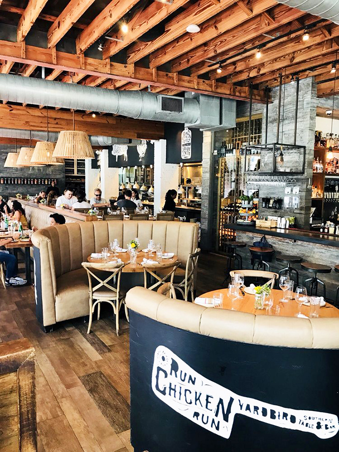 Where comfort meets sophistication. The "Run Chicken Run" sign isn't just decor—it's the restaurant's sense of humor on full display.