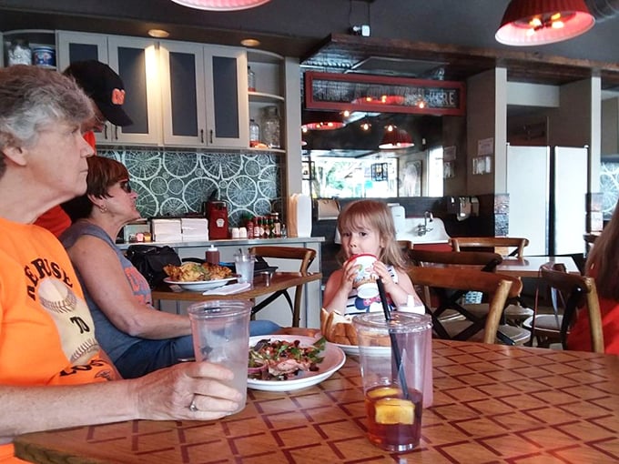 Multi-generational dining proves good barbecue transcends age gaps. That little one is being initiated into a lifetime of proper eating.