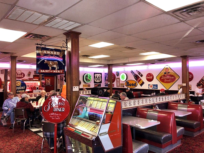 Red booths invite you to slide in and stay awhile, promising the kind of comfort that modern, minimalist restaurants have forgotten how to deliver. 