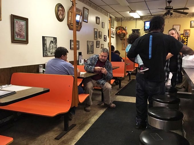 The diner's interior isn't decorated—it's curated with decades of Pittsburgh pride, where every framed memory tells a story between bites.