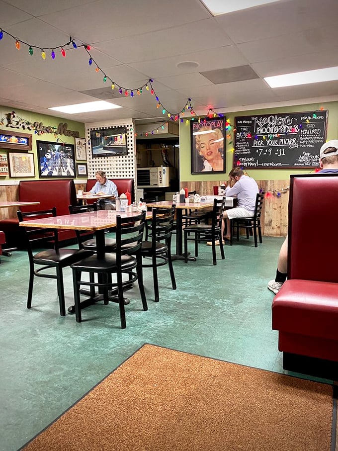 The green floor and red booths create a retro vibe that says, "Sit down, stay awhile, and order those hash browns."