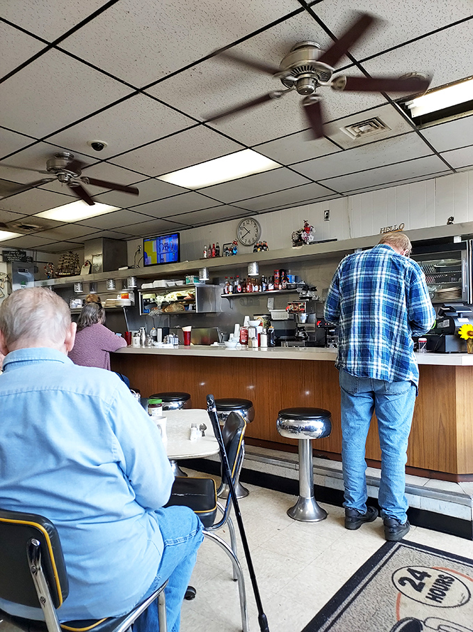 The counter seating&mdash;where regulars exchange local wisdom and servers remember your order before you've fully settled onto your stool.