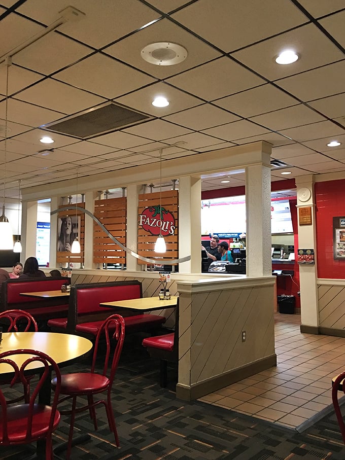 The dining room—where strangers united by their love of affordable pasta become temporary family. Red booths have heard many carb-induced confessions.