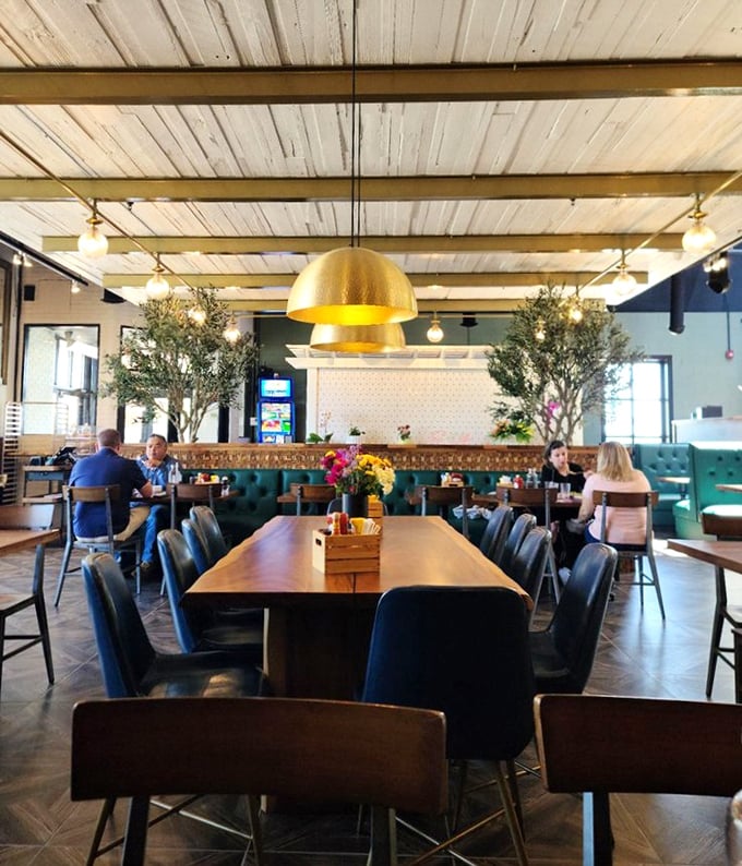 A dining room where breakfast isn't just served but celebrated &ndash; under golden pendant lights that make everyone look like they got enough sleep.