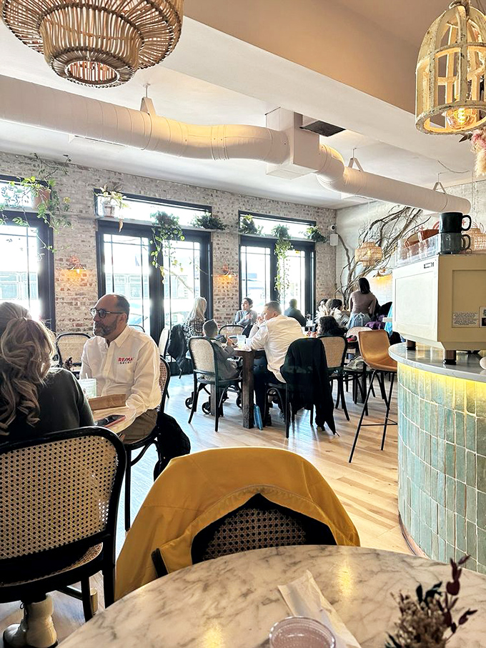 Bustling with diners beneath wicker light fixtures&mdash;this is where breakfast dreams and morning conversations intersect in delicious harmony.