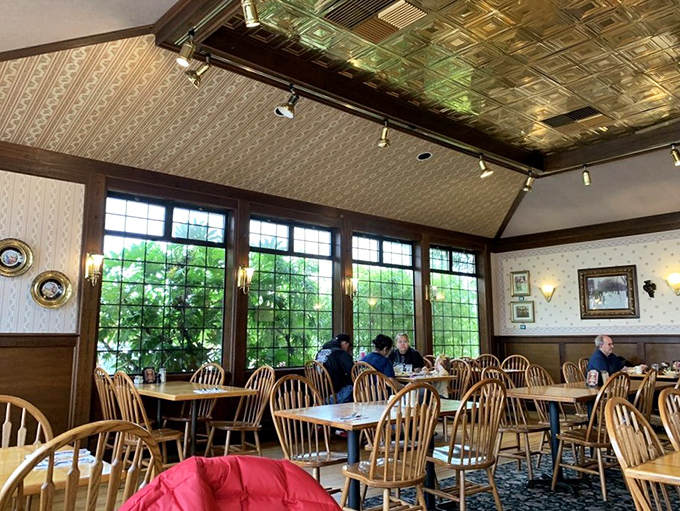 Bright windows flood the dining room with natural light, making even a cloudy Pacific Northwest morning feel cheerful. Those Windsor chairs have witnessed countless happy breakfasts.