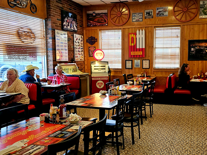 Wood paneling, vintage signs, and red booths create the quintessential diner atmosphere where breakfast traditions are honored and appetites are satisfied.