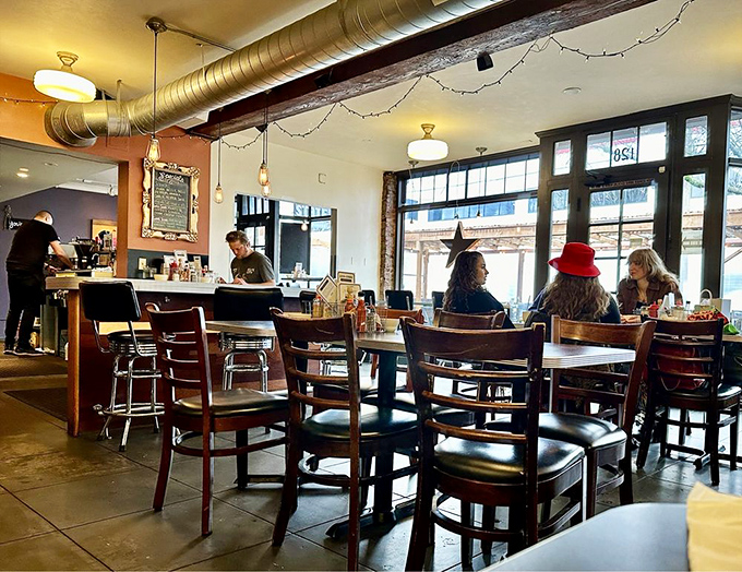 The dining room hums with the satisfied murmurs of people making good life choices. Those wooden chairs have supported countless "I'm too full" conversations.