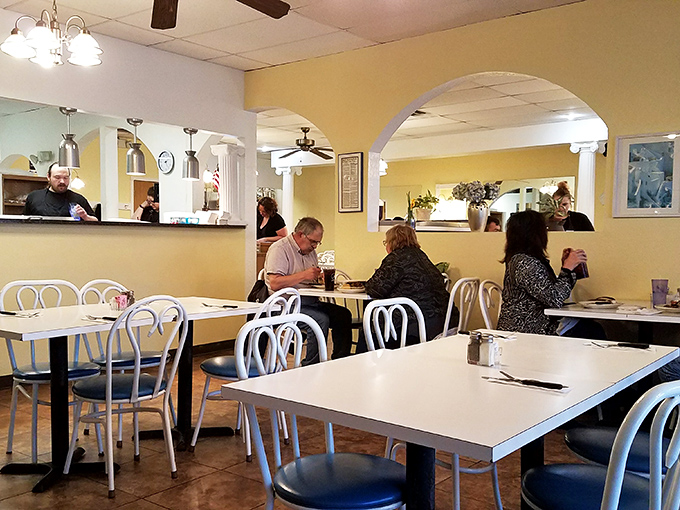A dining room where conversations flow as easily as the ouzo. Notice how nobody's on their phone? That's the power of really good food.