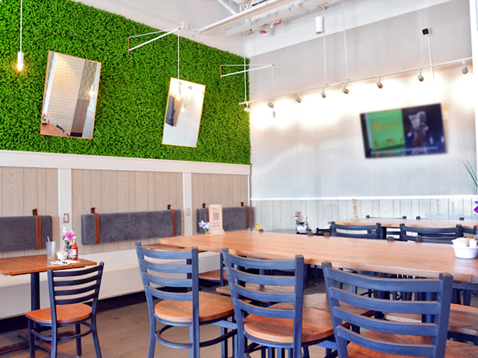 That green wall isn't just d&eacute;cor&mdash;it's a backdrop for the breakfast theater about to unfold at your table. 