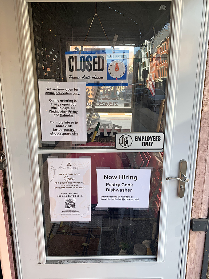 Behind this door, pastry wizards work their magic. The "Now Hiring" sign might be the career change you never knew you needed. 