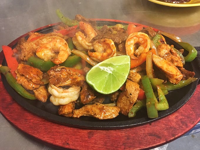 Sizzling fajitas arrive with that theatrical steam and aroma that turns every head in the dining room – food as performance art.