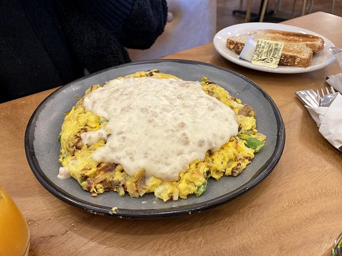 Beneath that blanket of country gravy lies a farmers frittata that worked overtime gathering all your favorite breakfast ingredients in one place.