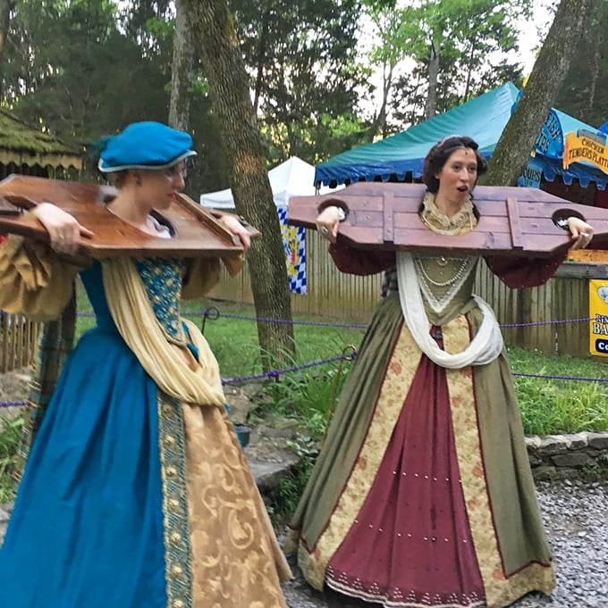 Festival performers in period-accurate costumes create immersive historical experiences, bringing medieval social customs to life with theatrical flair.