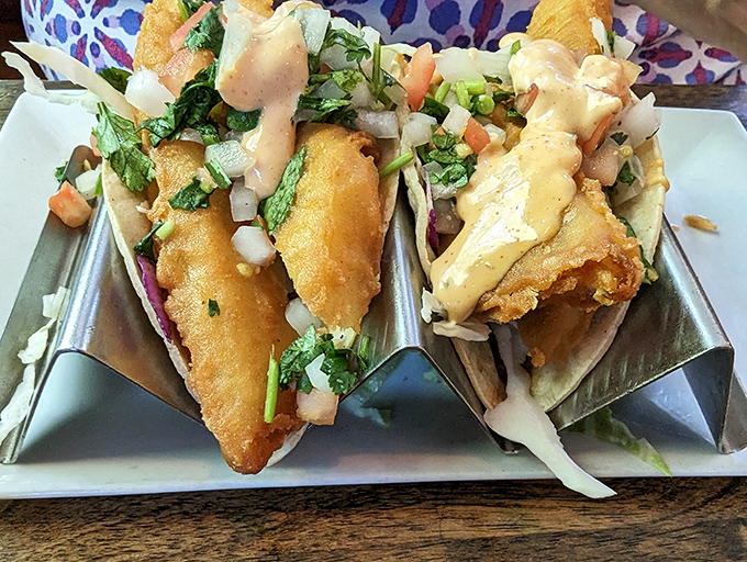 Fish tacos that balance crunch, cream, and garden-fresh toppings&mdash;architecture you can eat and art you can taste.