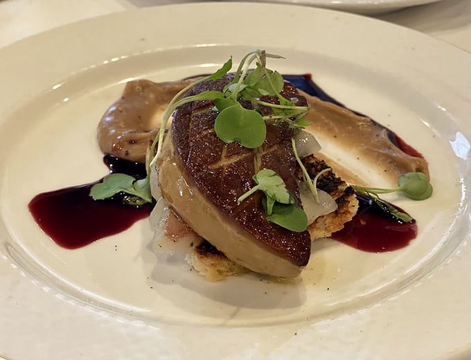 This perfectly seared foie gras isn't just food&mdash;it's edible poetry, plated with artistic precision and a sauce that deserves its own sonnet.