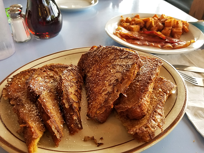 French toast that's had a proper education &ndash; crispy edges, custardy centers, and enough cinnamon to make your morning memorable.