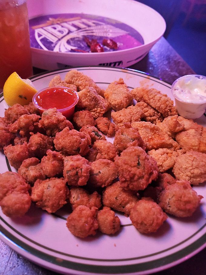 Fried okra and clams sharing a plate like old friends. The perfect Southern sidekick to your seafood adventure.
