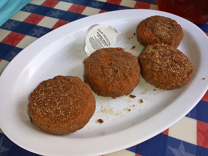 Hushpuppies&mdash;golden orbs of cornmeal joy that arrive at your table hot enough to make you do the "too-hot-to-eat-but-can't-wait" dance in your seat.