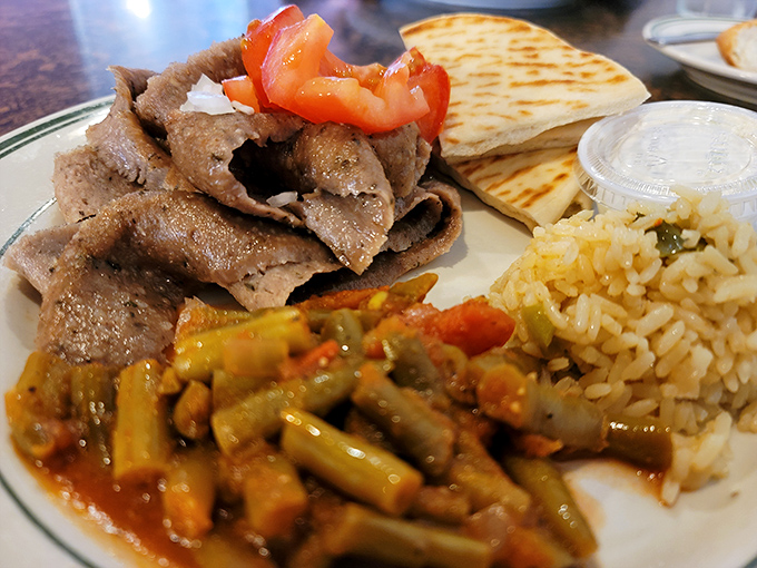 Gyros so authentic they should come with their own tiny Greek passport. That rice pilaf is playing the perfect supporting role.