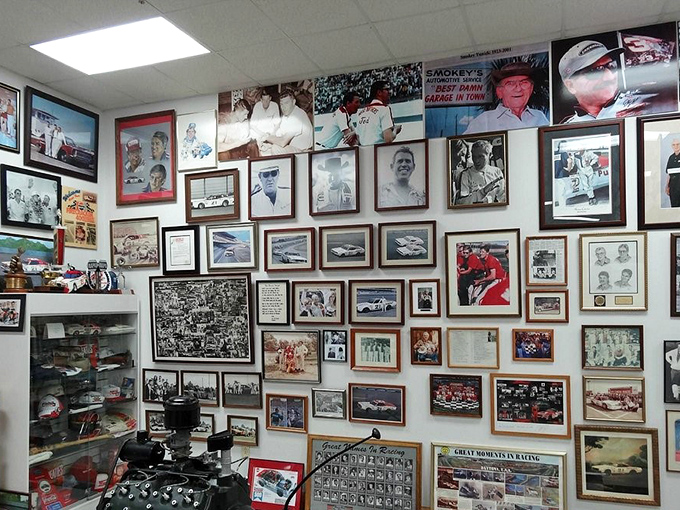 A wall of memories more valuable than any trophy. Each photo frame holds a chapter in America's racing novel, dog-eared from being loved.
