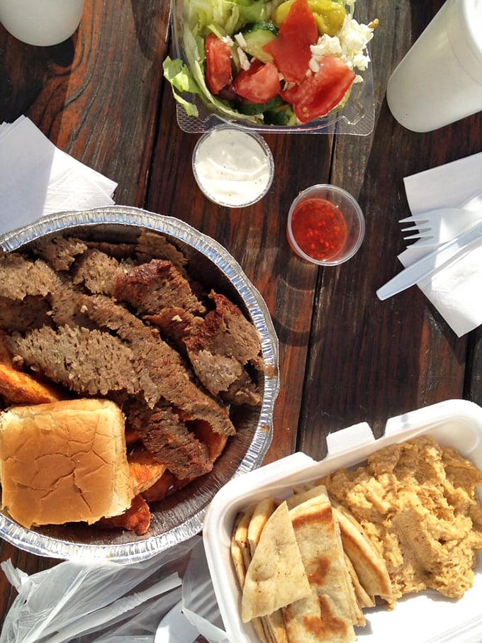 This spread isn't just a meal&mdash;it's a Mediterranean festival on wood. The hummus isn't a side dish; it's the creamy ambassador of chickpea diplomacy.