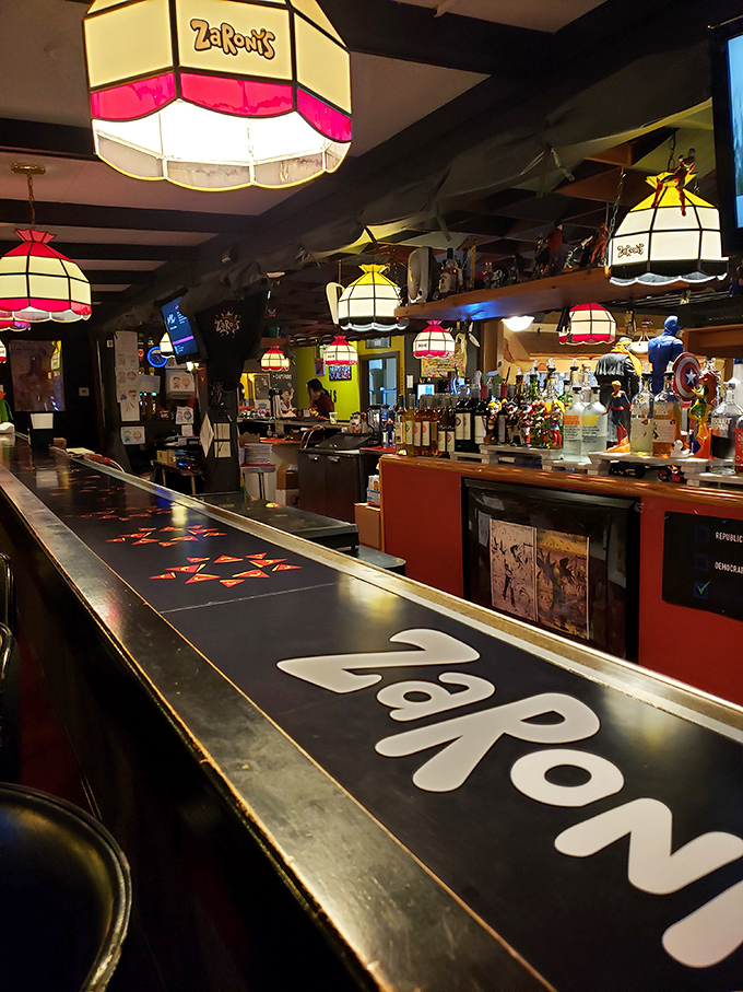 A bar that understands sometimes you need a cold one with your hot wings. The colorful bottle display promises adventures beyond just beer. 