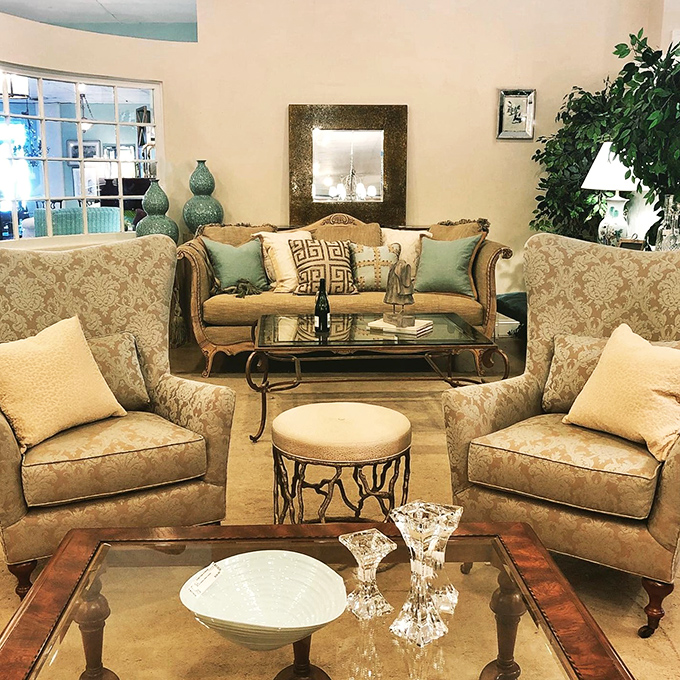 Neutral elegance with pops of green creates a living room that whispers "sophisticated adult." This is where you'd host friends you're trying to impress.