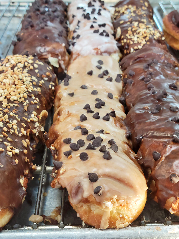 Long johns lined up like delicious edible Lincoln Logs, each one topped with enough peanuts or chocolate chips to make you weep with joy.
