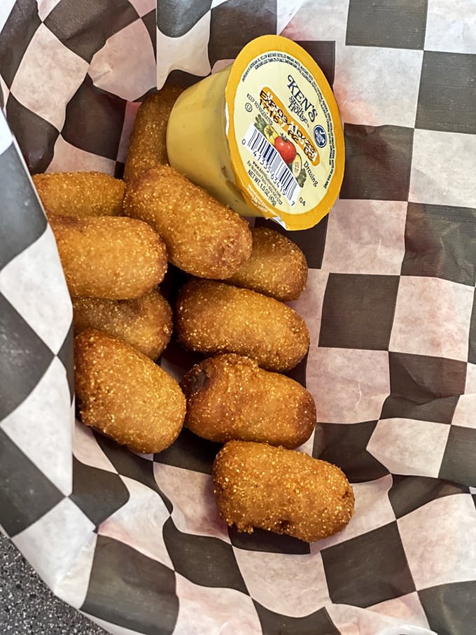 Mini corn dogs nestled in their checkered basket&mdash;nostalgic fair food that brings carnival joy without the Ferris wheel or cotton candy hair.
