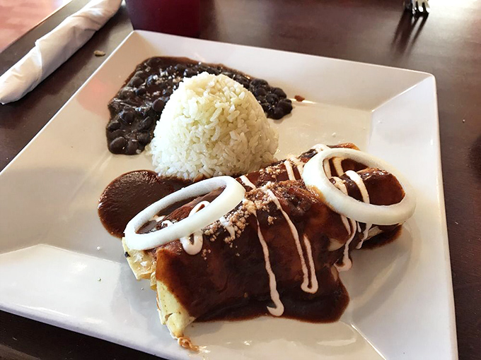 Mole enchiladas that prove sauce can be the main character&mdash;rich, complex, and drizzled with crema that cuts through the intensity perfectly.