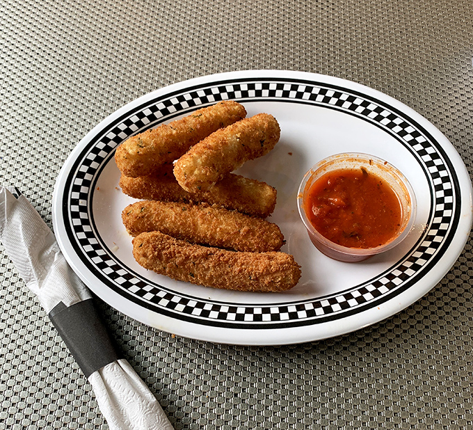 Golden-brown outside, molten perfection inside. These mozzarella sticks don't just stretch&mdash;they perform a full gymnastics routine.