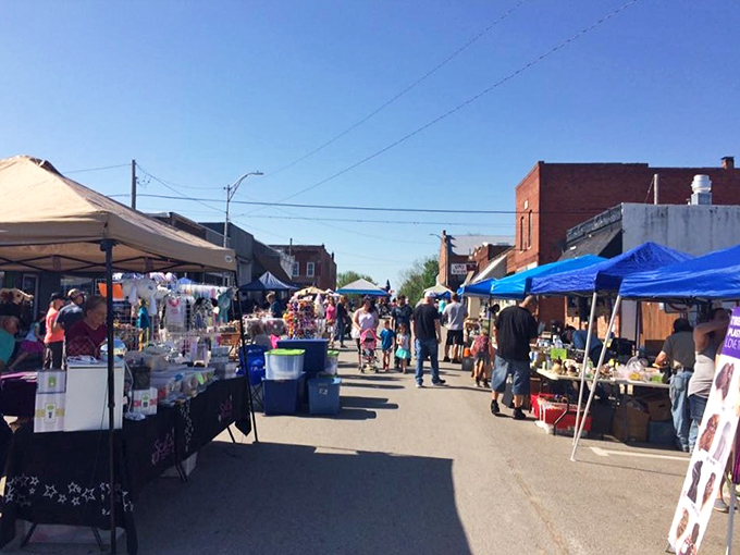 The farmers market transforms Main Street into a bustling marketplace – where conversations with vegetable vendors replace impersonal checkout screens.