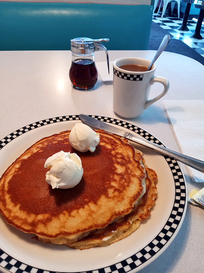 Pancakes so perfect they make maple syrup feel privileged to be invited. Those dollops of butter are just melting with anticipation.