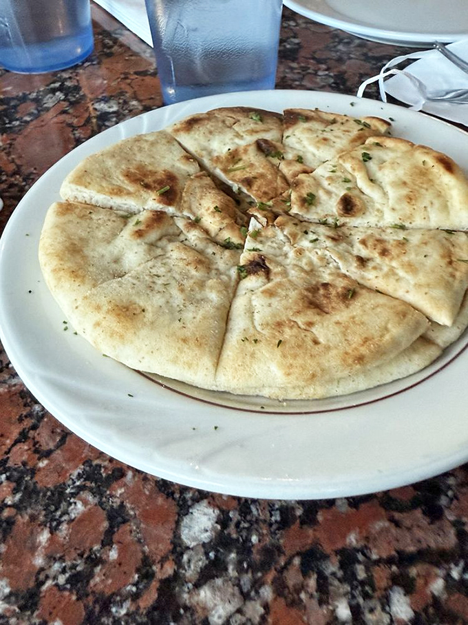 Warm, pillowy pita bread with those perfect grill marks&mdash;the unsung hero of Greek cuisine and the ideal vehicle for tzatziki delivery.