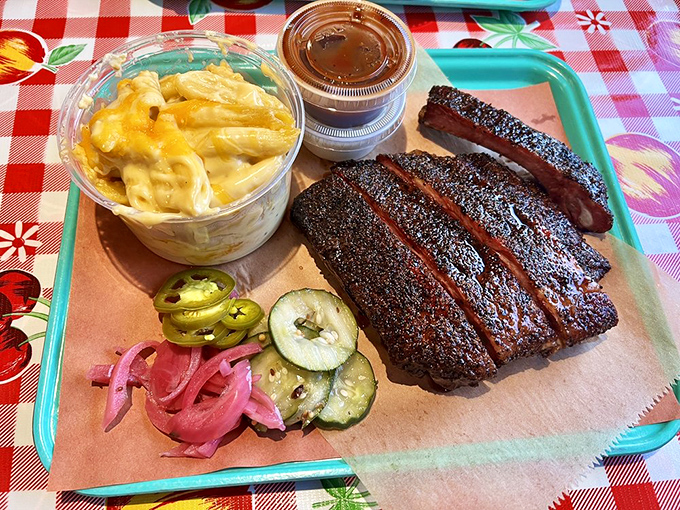 Ribs with a bark so perfect you'll want to frame them before eating. That smoke ring is wearing its Sunday best. 