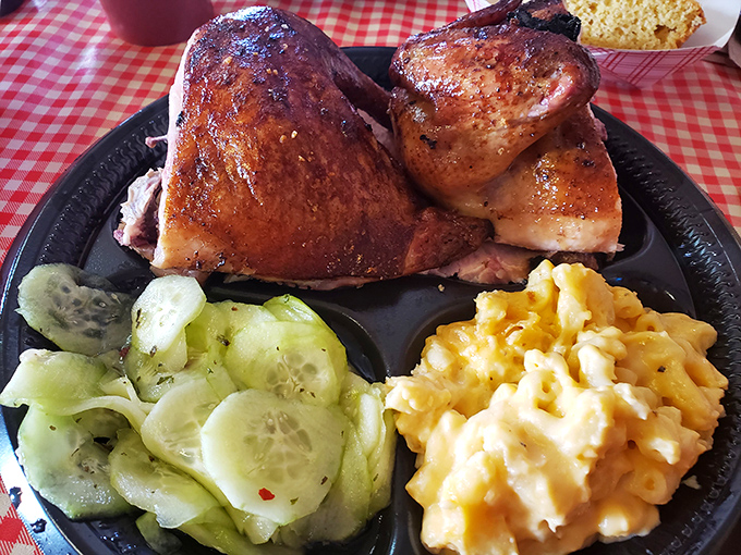 Smoked chicken with skin so beautifully bronzed it deserves its own trophy, flanked by cucumber salad and mac and cheese.