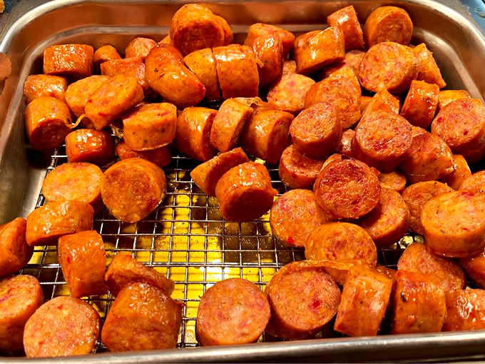 Sausage slices glistening with promise &ndash; each one a spicy, savory coin from the Southern food bank of happiness.