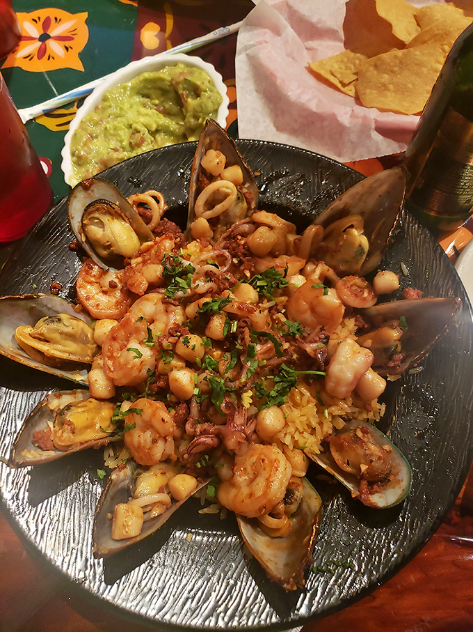 This seafood extravaganza is the ocean's greatest hits album &ndash; shrimp, mussels, and scallops performing in perfect harmony on a bed of Spanish rice. 