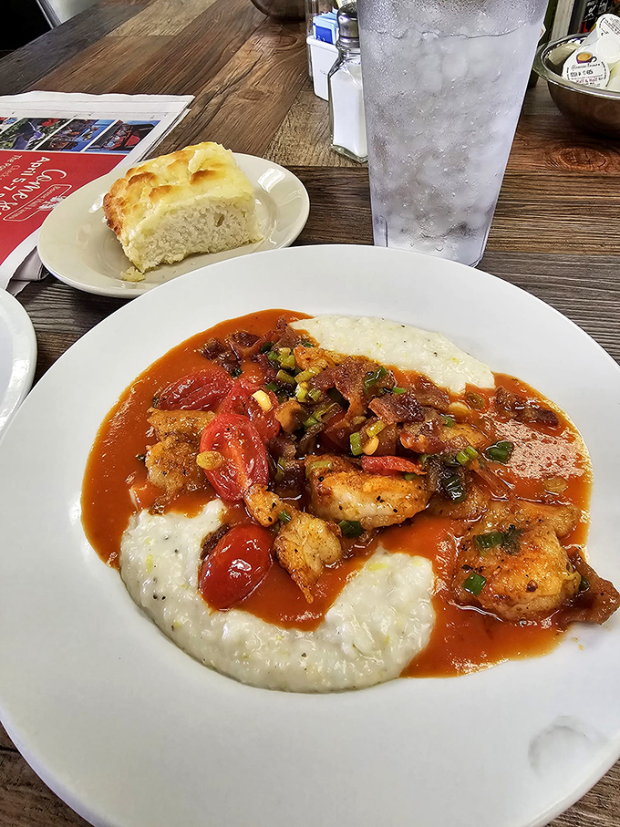 Shrimp and grits that could make a Northerner relocate to Charleston. Local seafood swimming in tomato gravy atop creamy grits&mdash;the South's most persuasive argument.