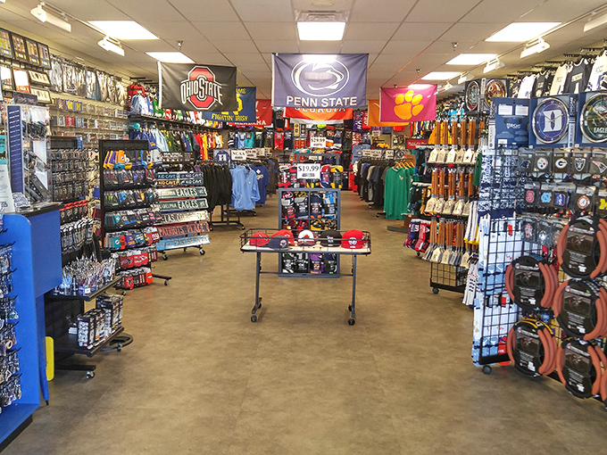 College pride on full display, where rival teams share peaceful shelf space in this sports memorabilia wonderland.