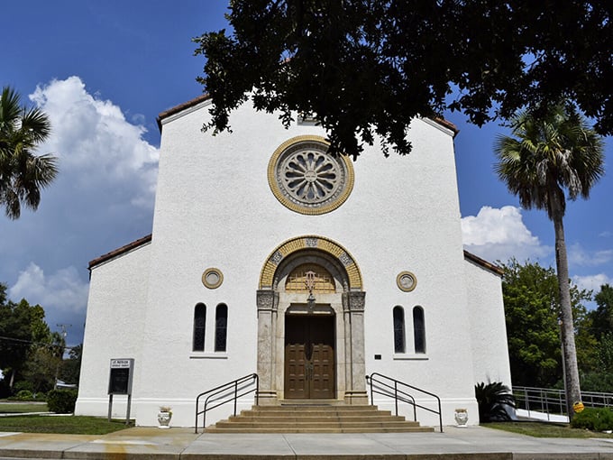 St. Patrick Catholic Church's striking white facade and rose window stand as architectural testament to the town's diverse cultural influences.